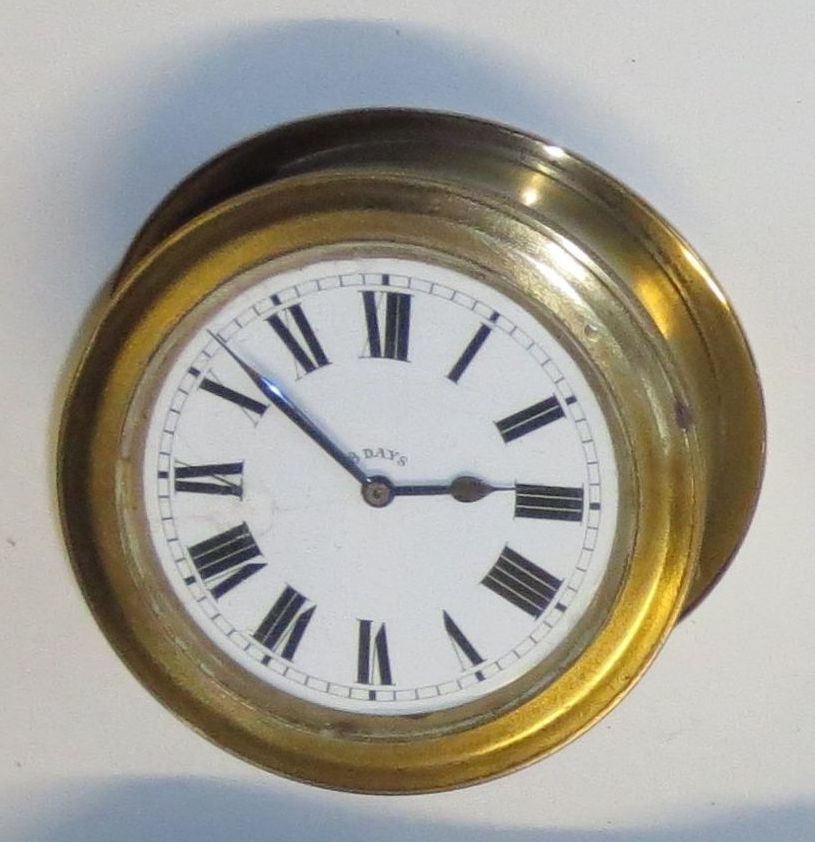 Bonhams Cars : A brass 8-day car clock for dashboard mounting,