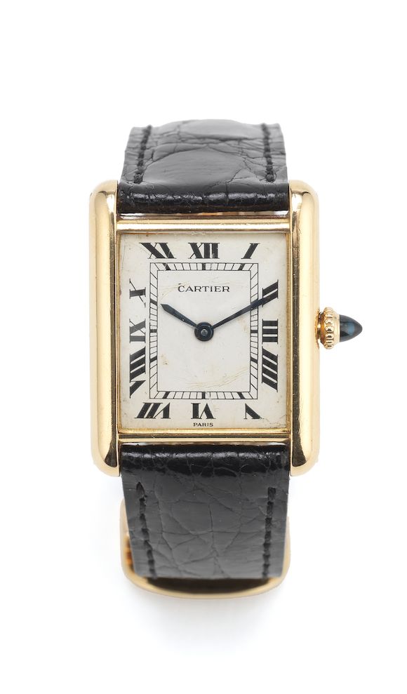 Bonhams : CARTIER: A 18 carat gold cased tank wristwatch with deployant ...