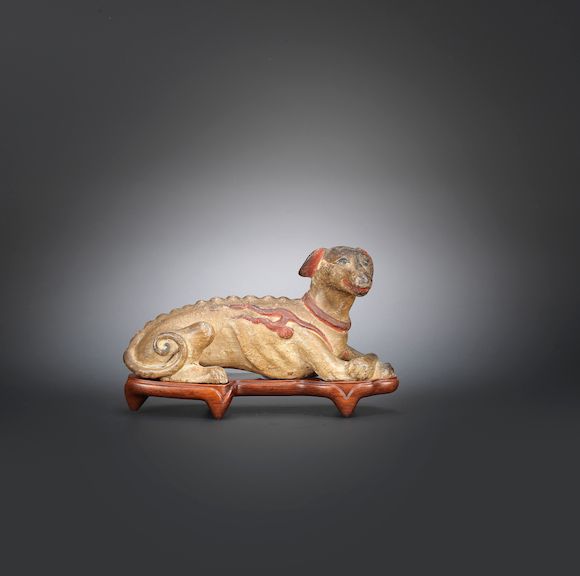 Bonhams : An extremely rare lacquered wood dog with huanghuali stand ...