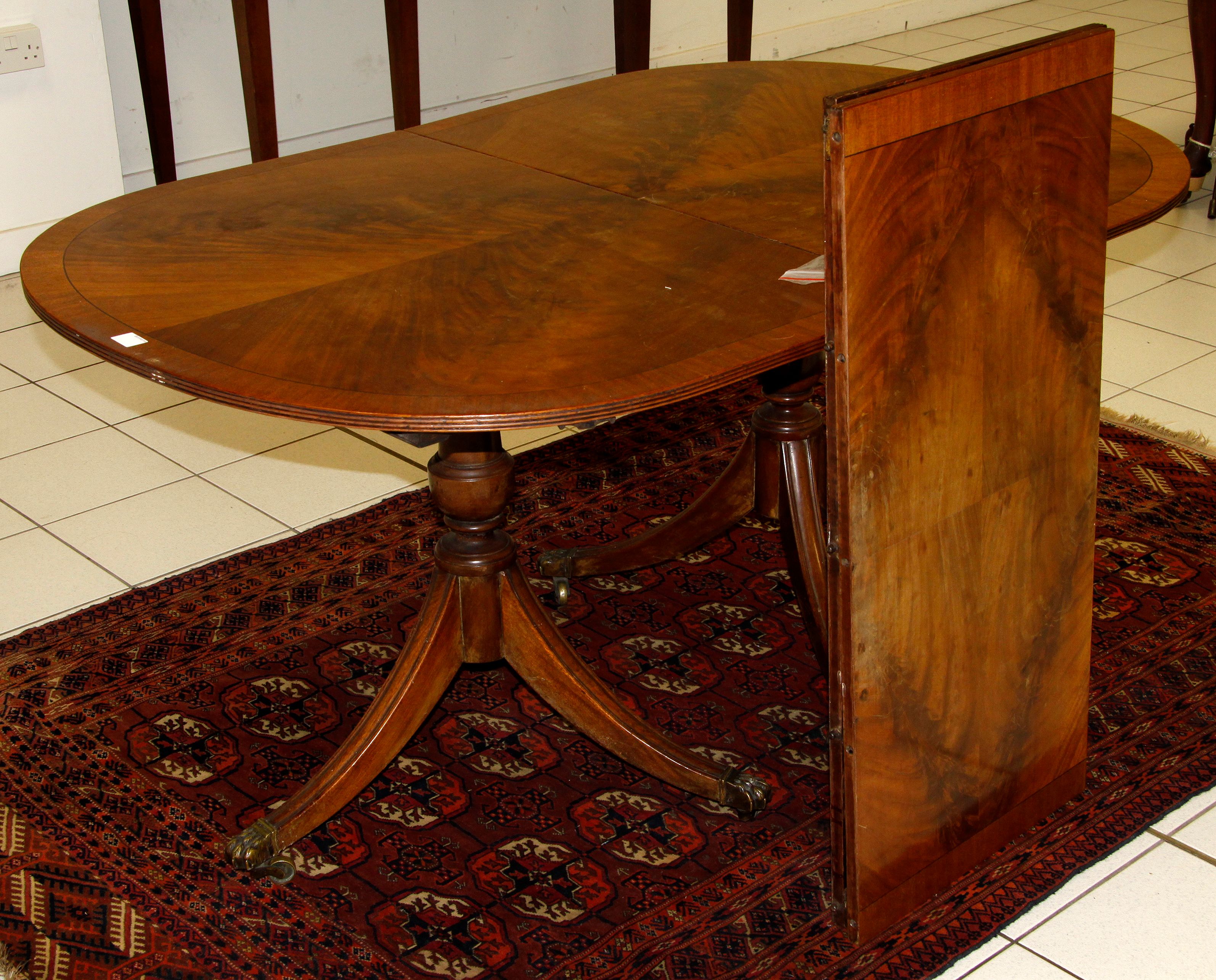 Bonhams : A reproduction mahogany twin pedestal dining table