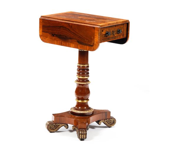Bonhams : A rosewood and gilt-decorated drop-leaf pedestal work table