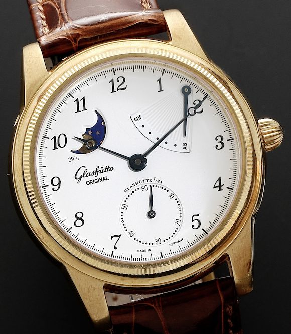 Bonhams : Glashutte. An 18ct gold manual wind wristwatch with power reserve and phases of the ...