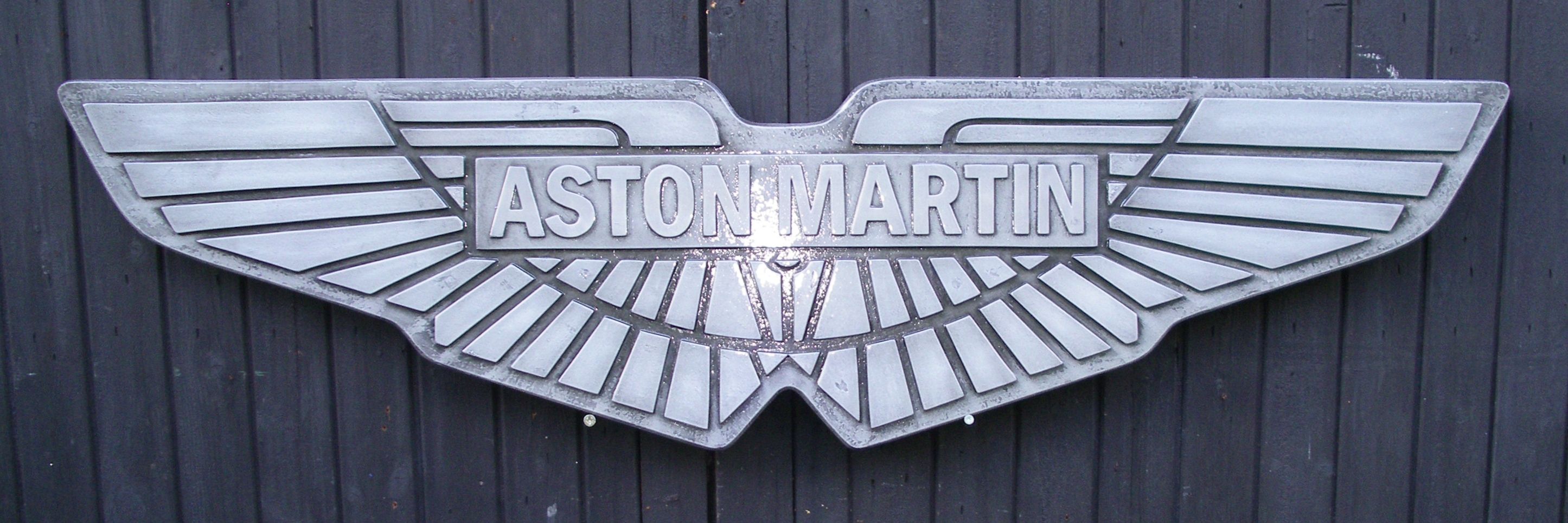 Bonhams Cars : An Aston Martin winged badge display emblem,