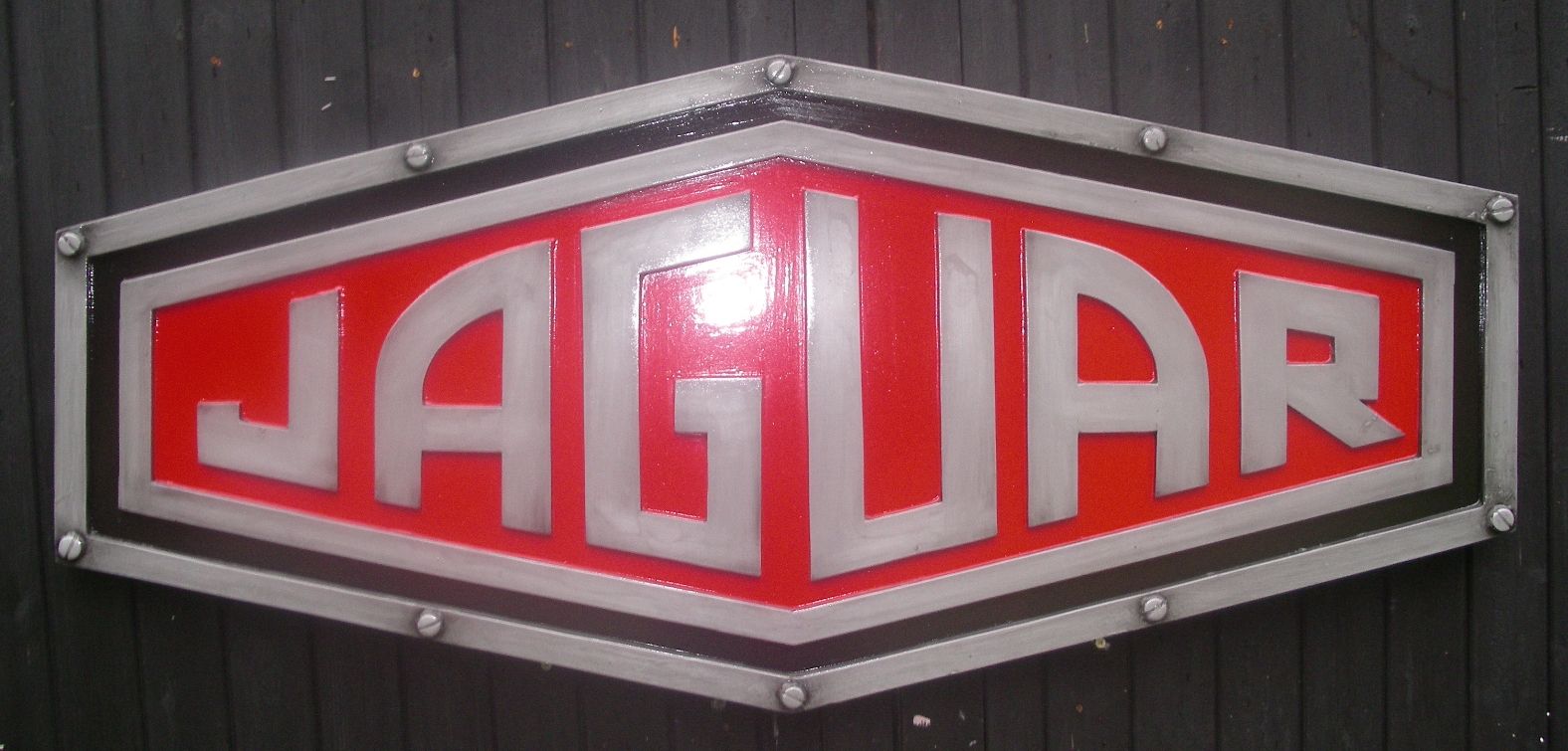Bonhams Cars : A Jaguar badge garage display emblem,