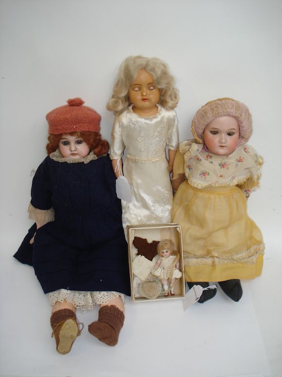 Bonhams : Four dolls and dolls clothing lot