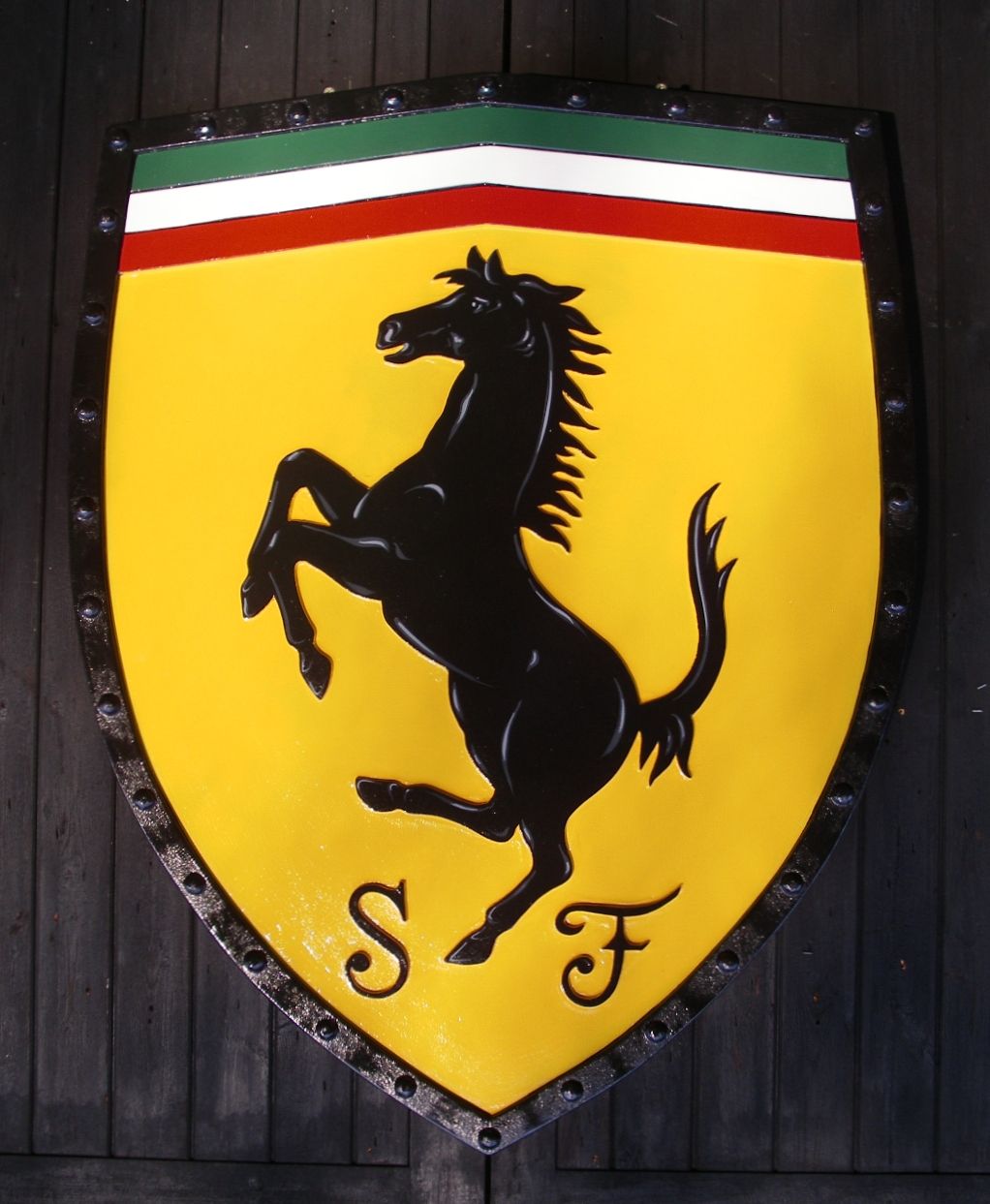 Bonhams Cars : A hand-painted 'Ferrari' garage display shield,