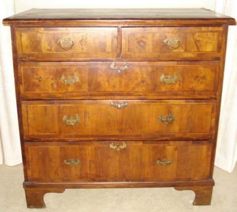 Bonhams : An 18th Century crossbanded walnut chest, of two short and ...