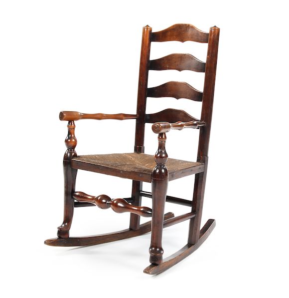 Bonhams : A 19th century child's fruitwood ladder-back rocking chair