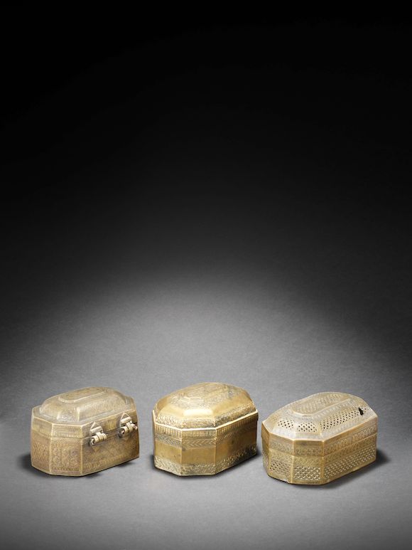Bonhams : Three engraved brass lidded pandan Boxes India, 17th Century(3)