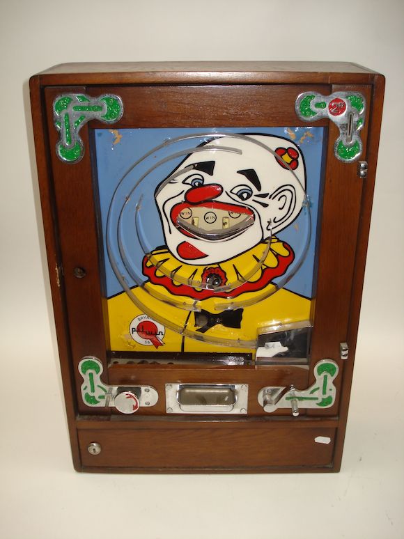 Bonhams : A Bryans Pil-Win wall machine,