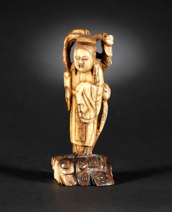 Bonhams : A stained ivory figure Qing Dynasty