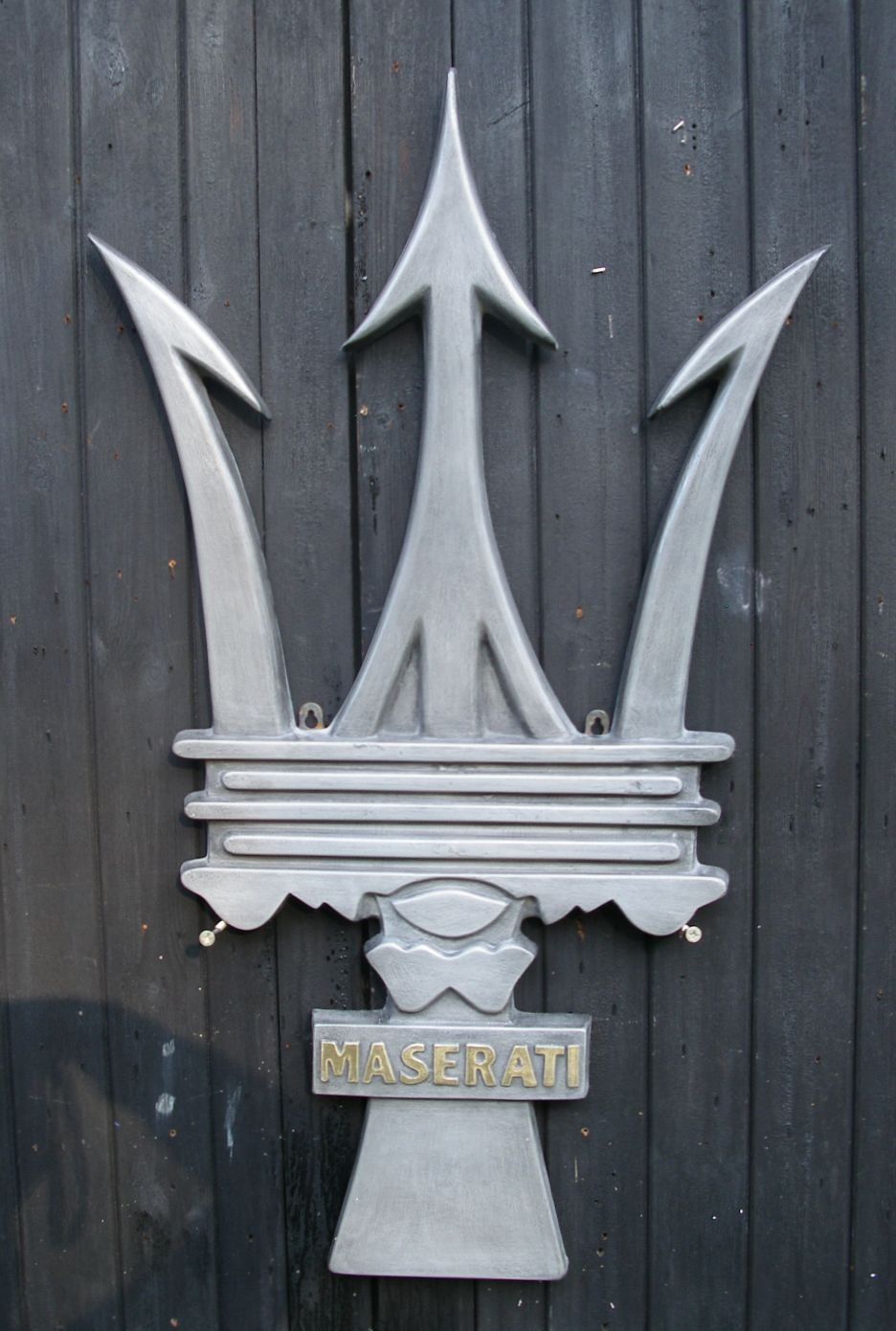 Bonhams Cars : A 'Maserati' Trident garage display emblem,