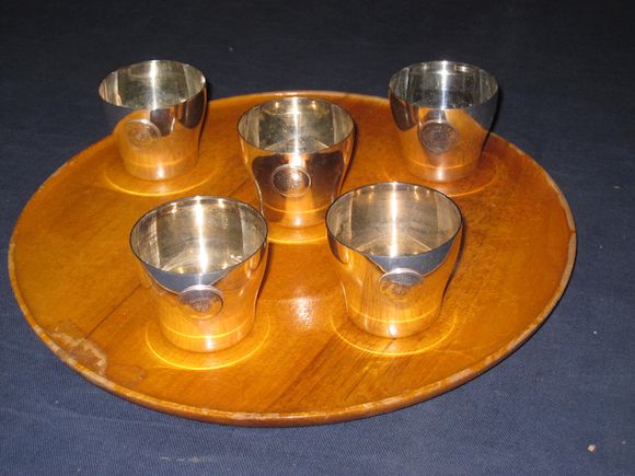 Bonhams : A set of five 20th century German white metal beakers, tray