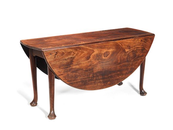 Bonhams : A George II figured mahogany drop flap dining table