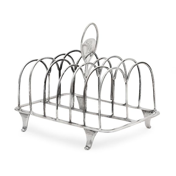 Bonhams : A George III silver toast rack by Michael Plummer, London 1793