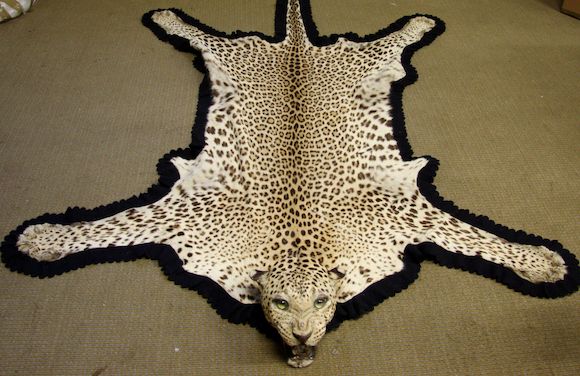 Bonhams : A leopard skin rug with full mount headBy Van Ingen & Van ...