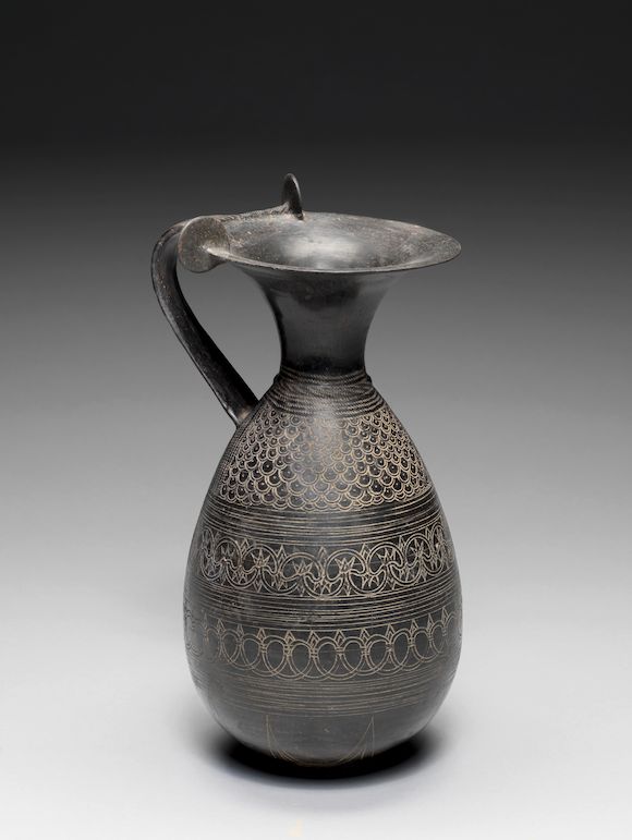 Bonhams : An Etruscan bucchero ware olpe