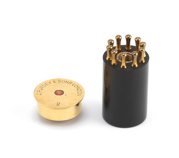 Bonhams : A brass and wood cartridge place-finder by J. Purdey & Sons