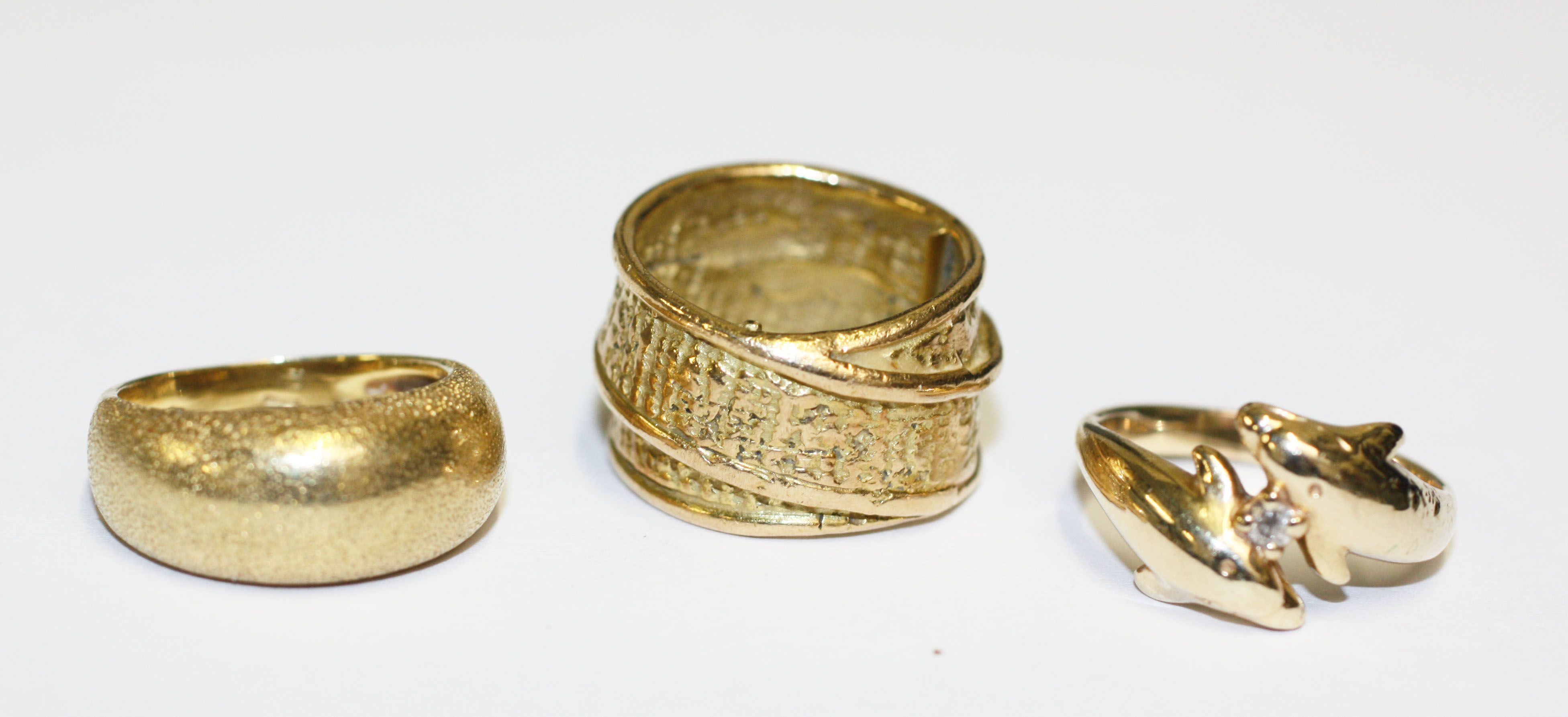 Bonhams : Three yellow precious metal rings,
