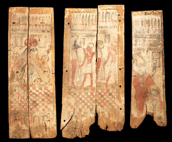 Bonhams : Three Egyptian wood polychrome sarcophagus panels