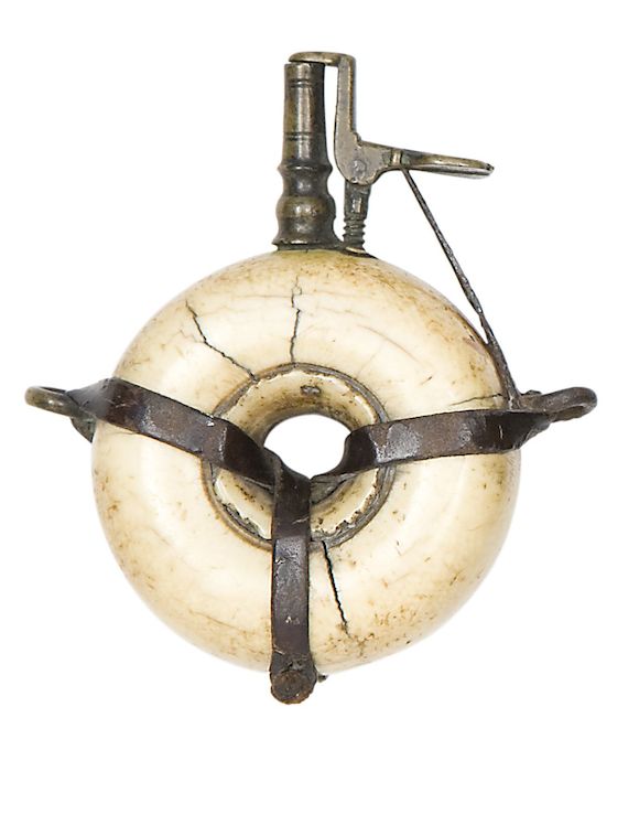 Bonhams : A German Or Dutch Circular Ivory Priming-Flask