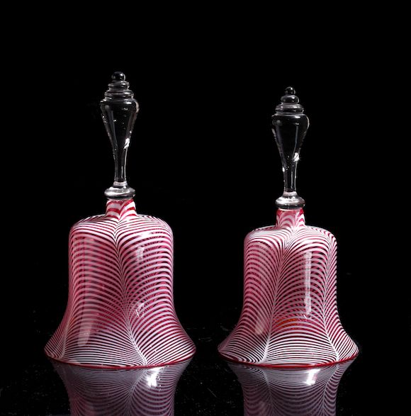 Bonhams : Two late 19th Century cranberry glass bells
