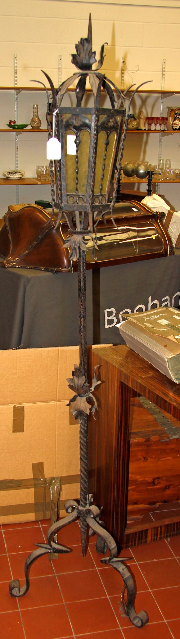 Bonhams : A wrought iron lamp stand,