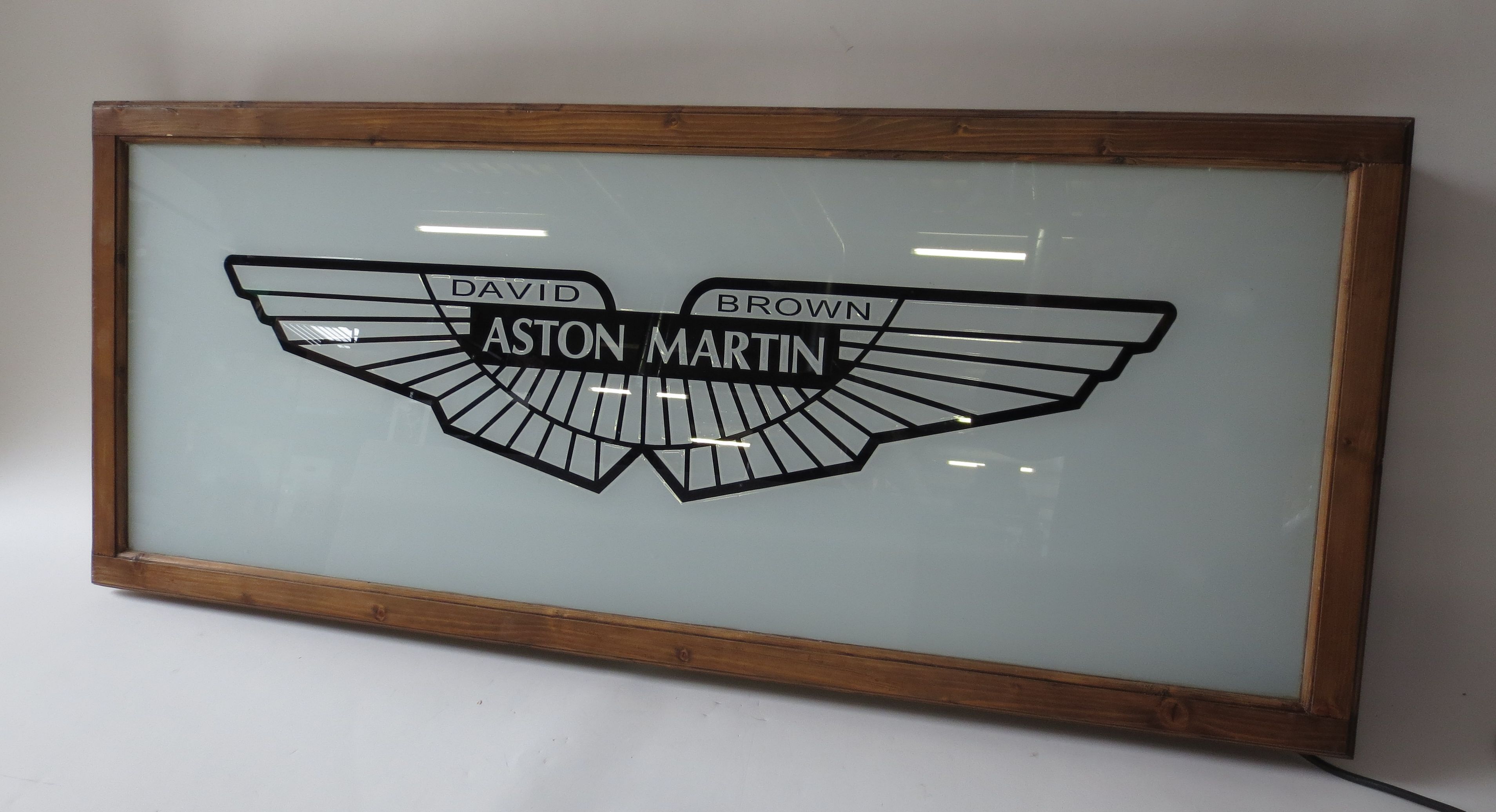 Bonhams Cars : A 'David Brown Aston Martin' light box sign,