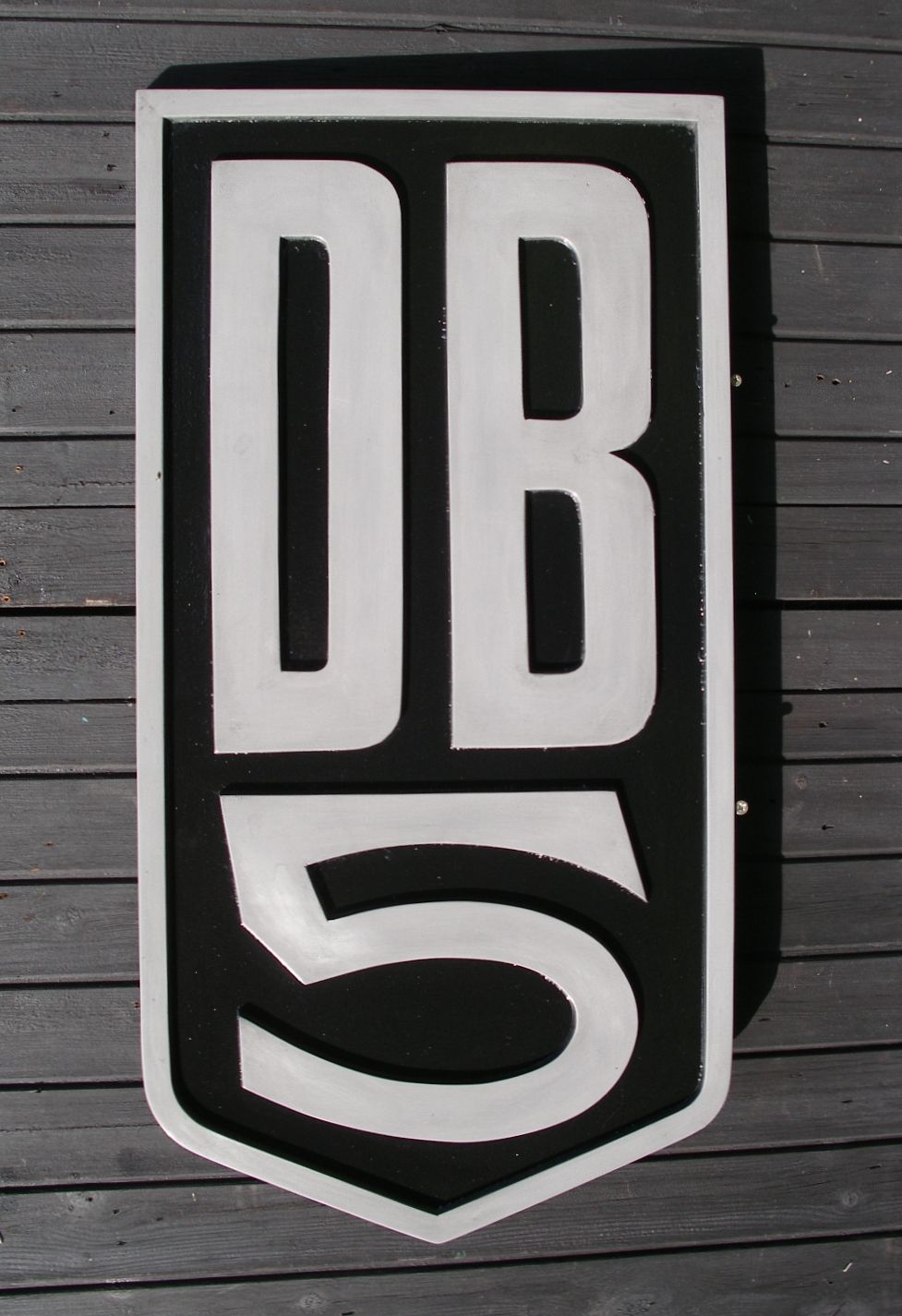 Bonhams Cars : An Aston Martin DB5 garage display emblem,