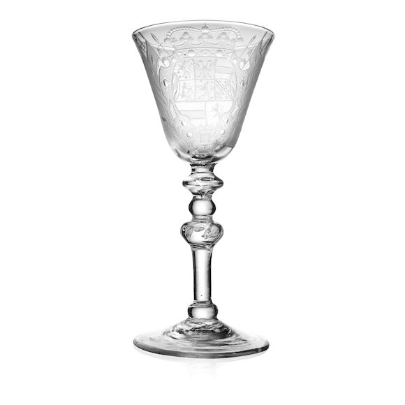 Bonhams : A Dutch light baluster engraved armorial wine glass Circa 1760