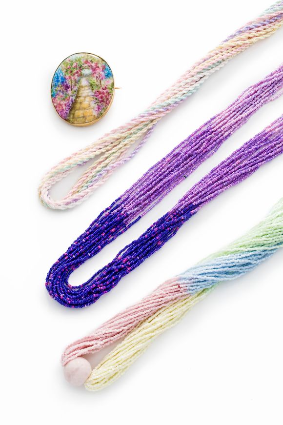 Bonhams : A group of glass bead 'flapper' necklaces, and a brooch,