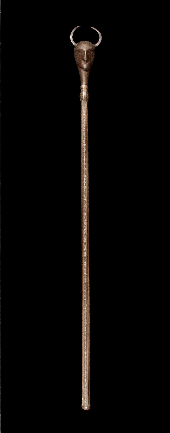 Bonhams : A Qajar silver and gold damascened steel Mace in the form of ...
