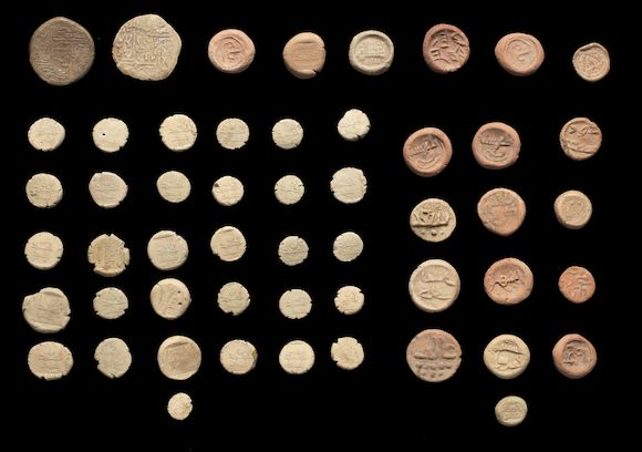 Bonhams : Three boxes of Umayyad stamped clay Tokens Syria and Egypt ...