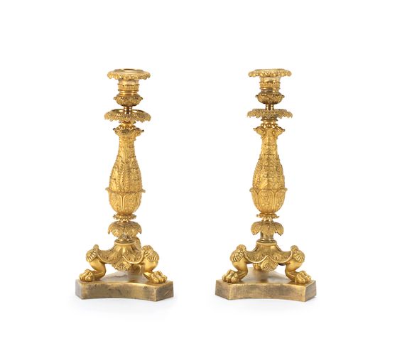 Bonhams : A pair of French Restoration gilt bronze candlesticks