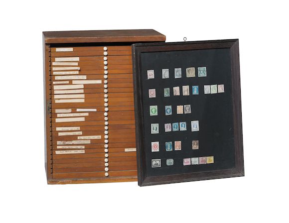Bonhams : A collection of stamps in a pine collector's cabinet