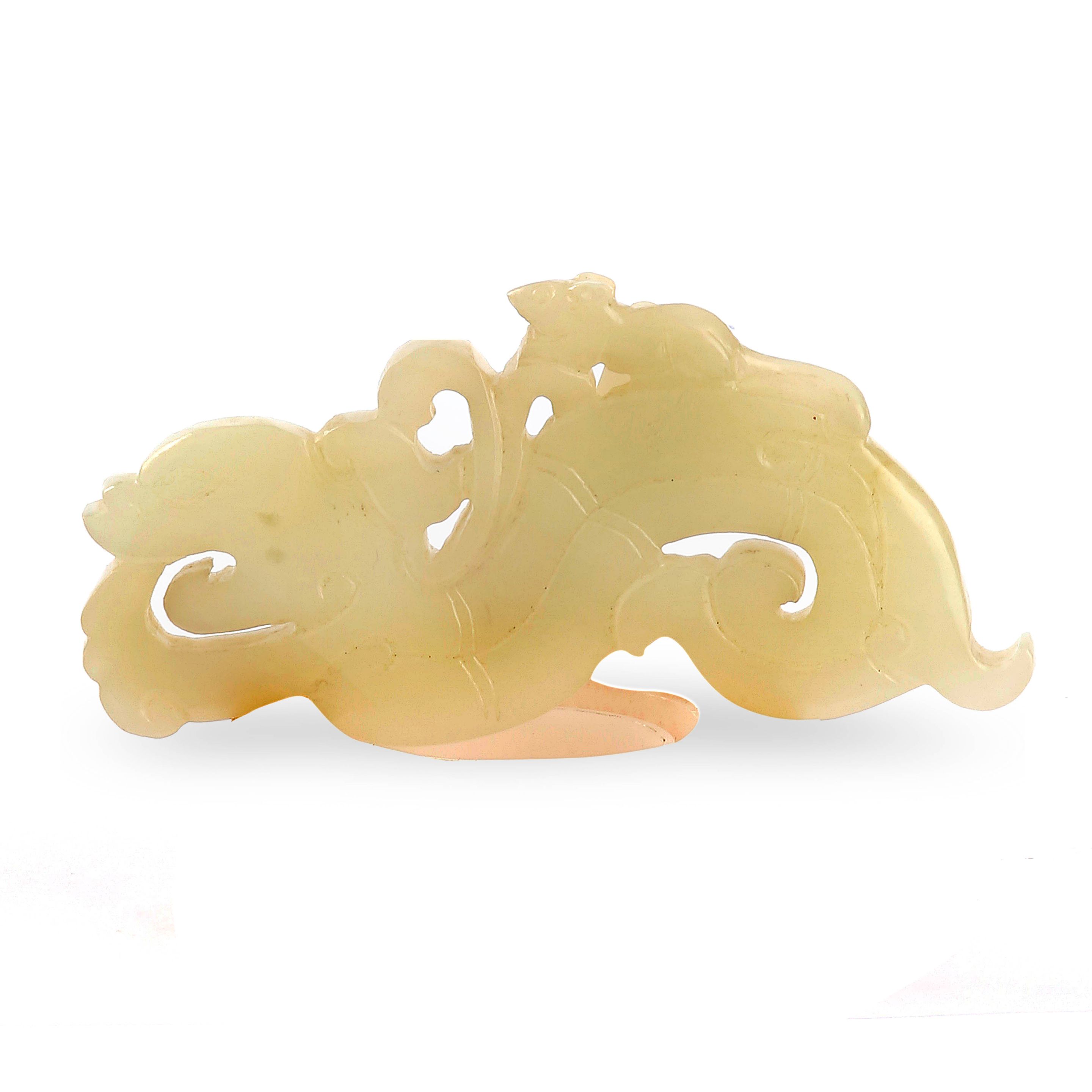 Bonhams : A Chinese jade carving of a mouse riding a kui dragon