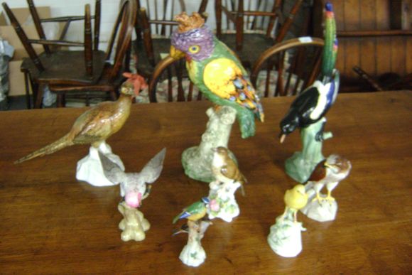 Bonhams : A collection of eight ceramic bird figures,including hawks ...