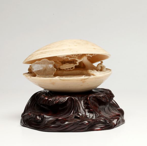 Bonhams : A carved ivory 'clam's dream', on hardwood stand