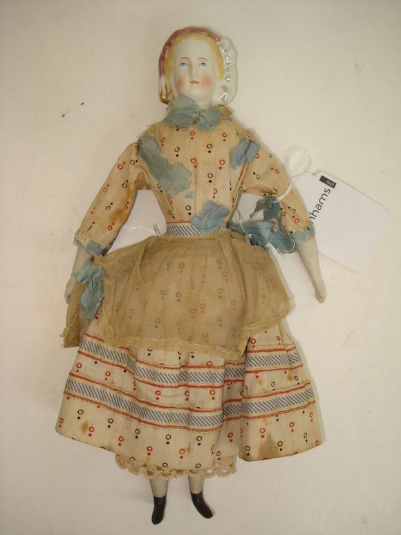 Bonhams : Parian-type shoulder head doll with snood