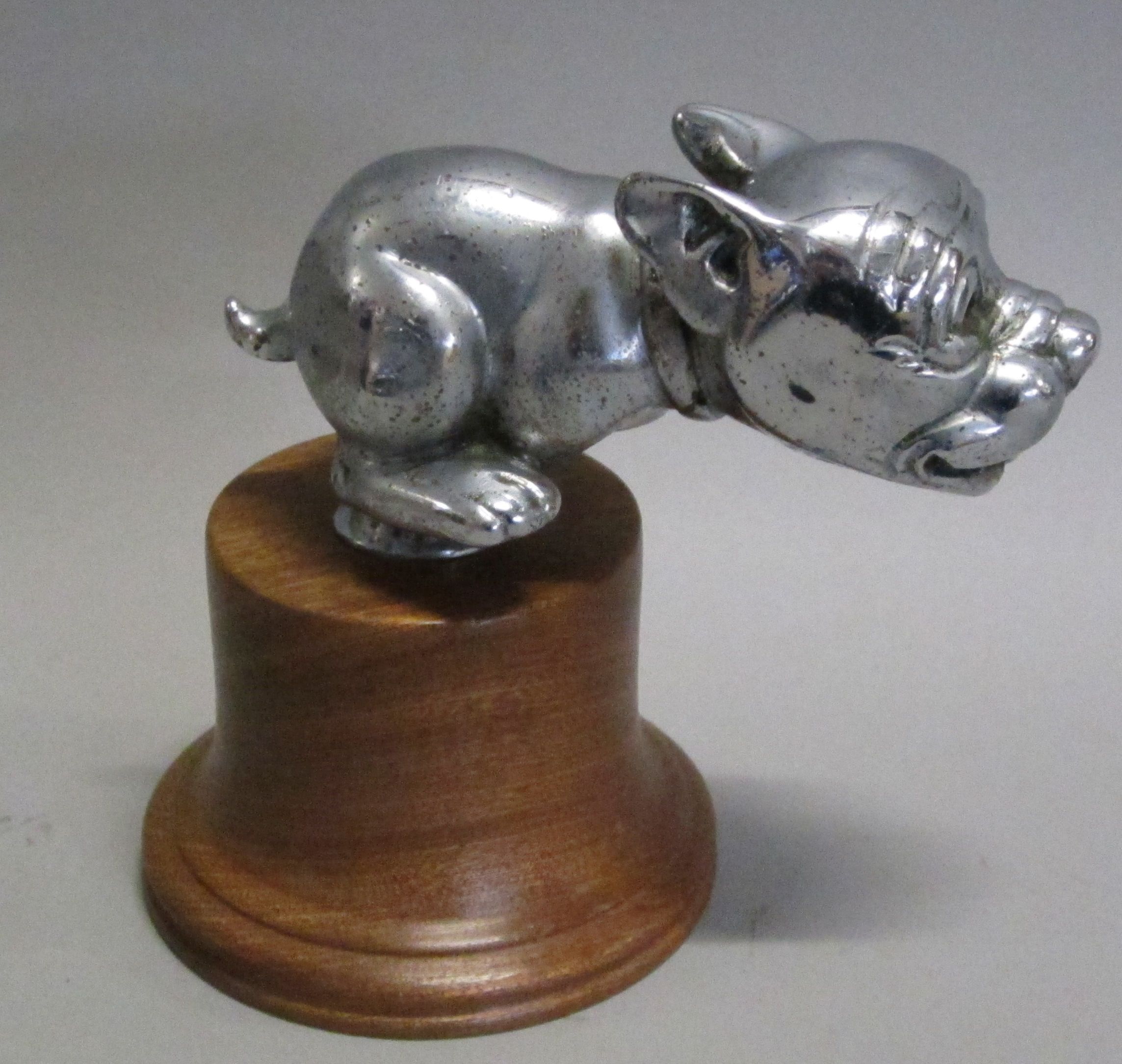 Bonhams Cars : A Telcote Pup mascot after George Studdy, 1920s,
