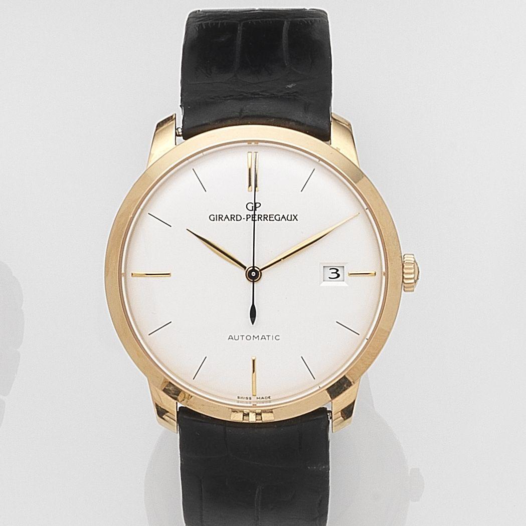 Bonhams : Girard-Perregaux. An 18ct gold automatic calendar ...
