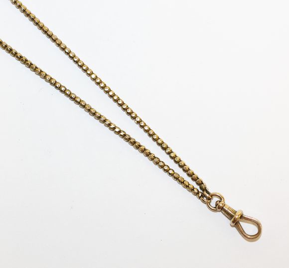 Bonhams : A yellow precious metal long chain,