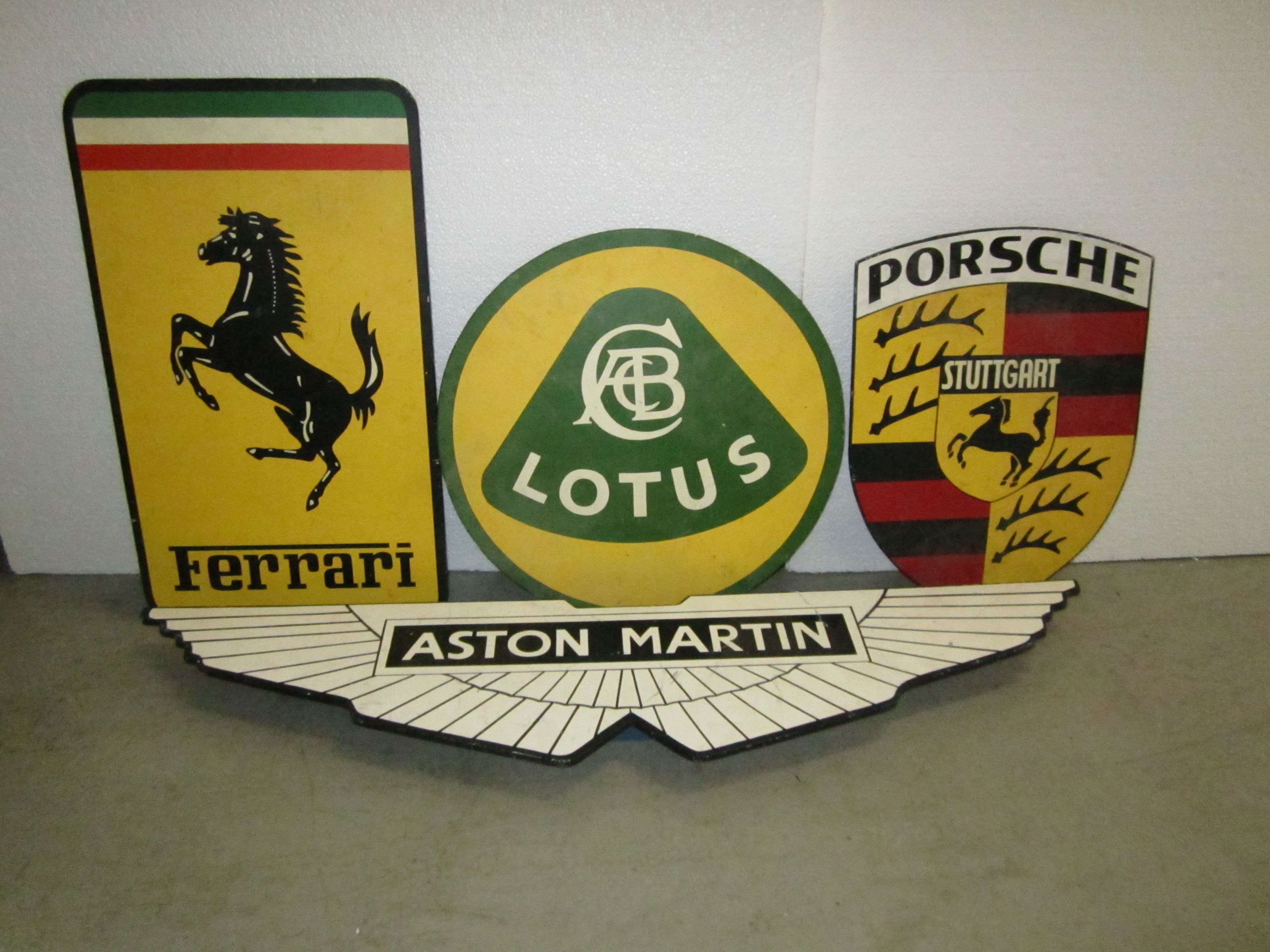Bonhams Cars : Four painted 'car badge' wall mounts for Aston Martin ...