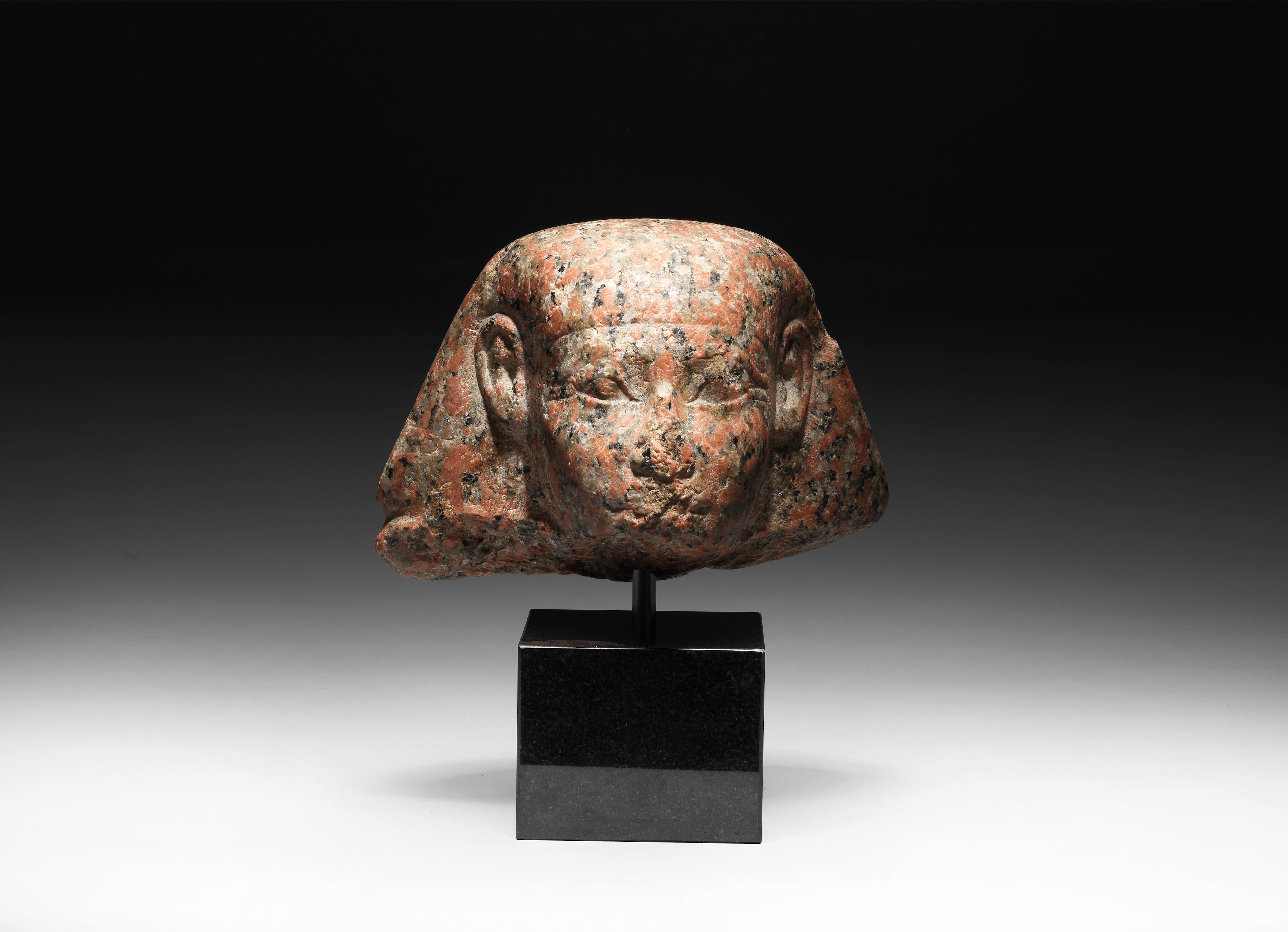 Bonhams : An Egyptian rose granite male head