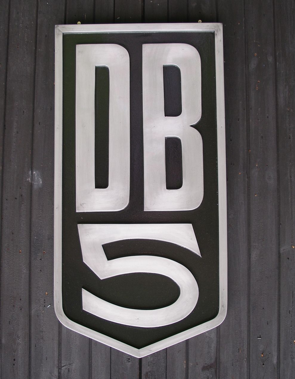 Bonhams Cars : An Aston Martin DB5 garage display emblem,