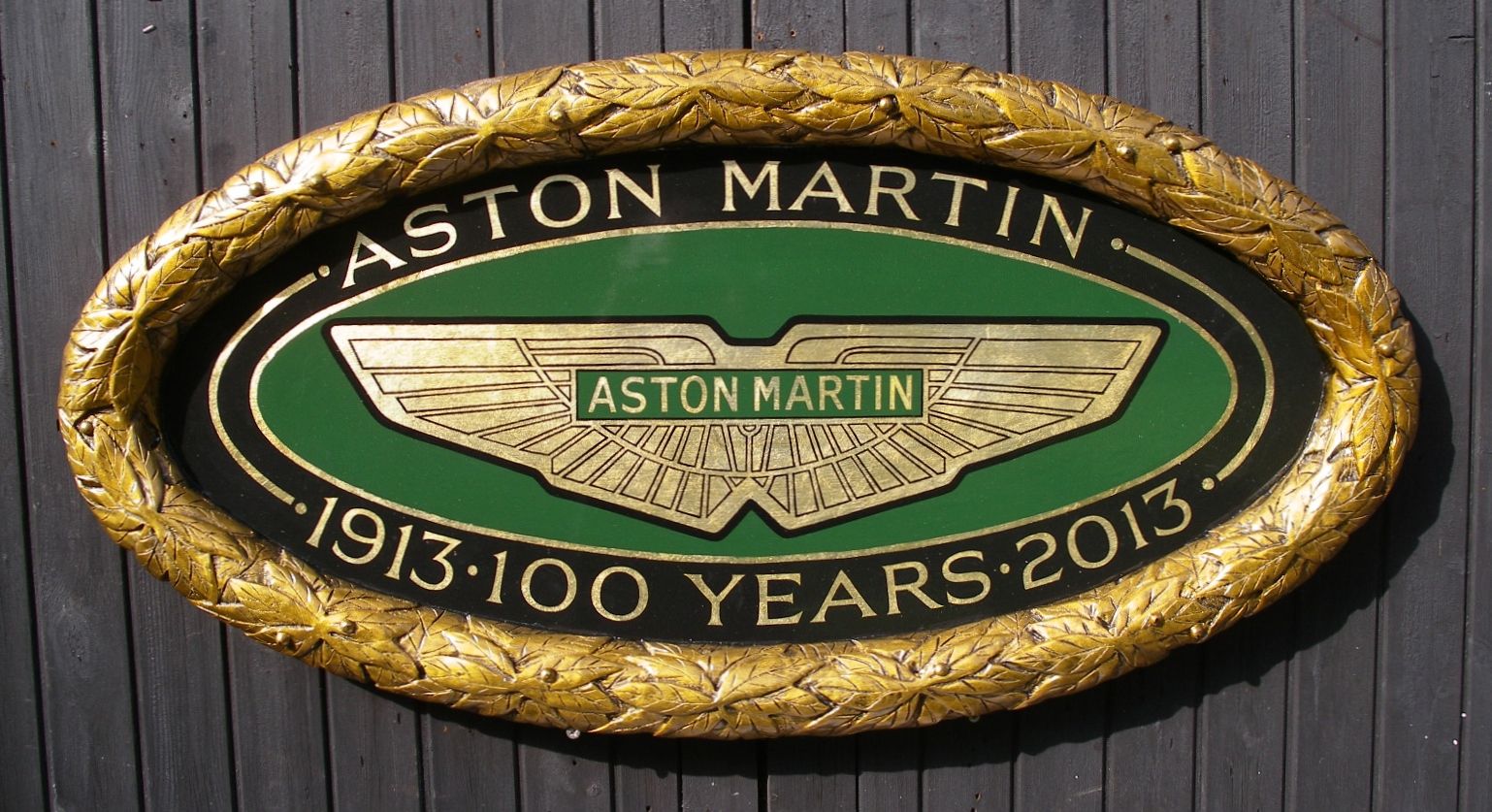 Bonhams Cars : A hand-painted Aston Martin Centenary display roundel,