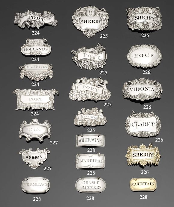 Bonhams : Four cast silver wine labels (4)