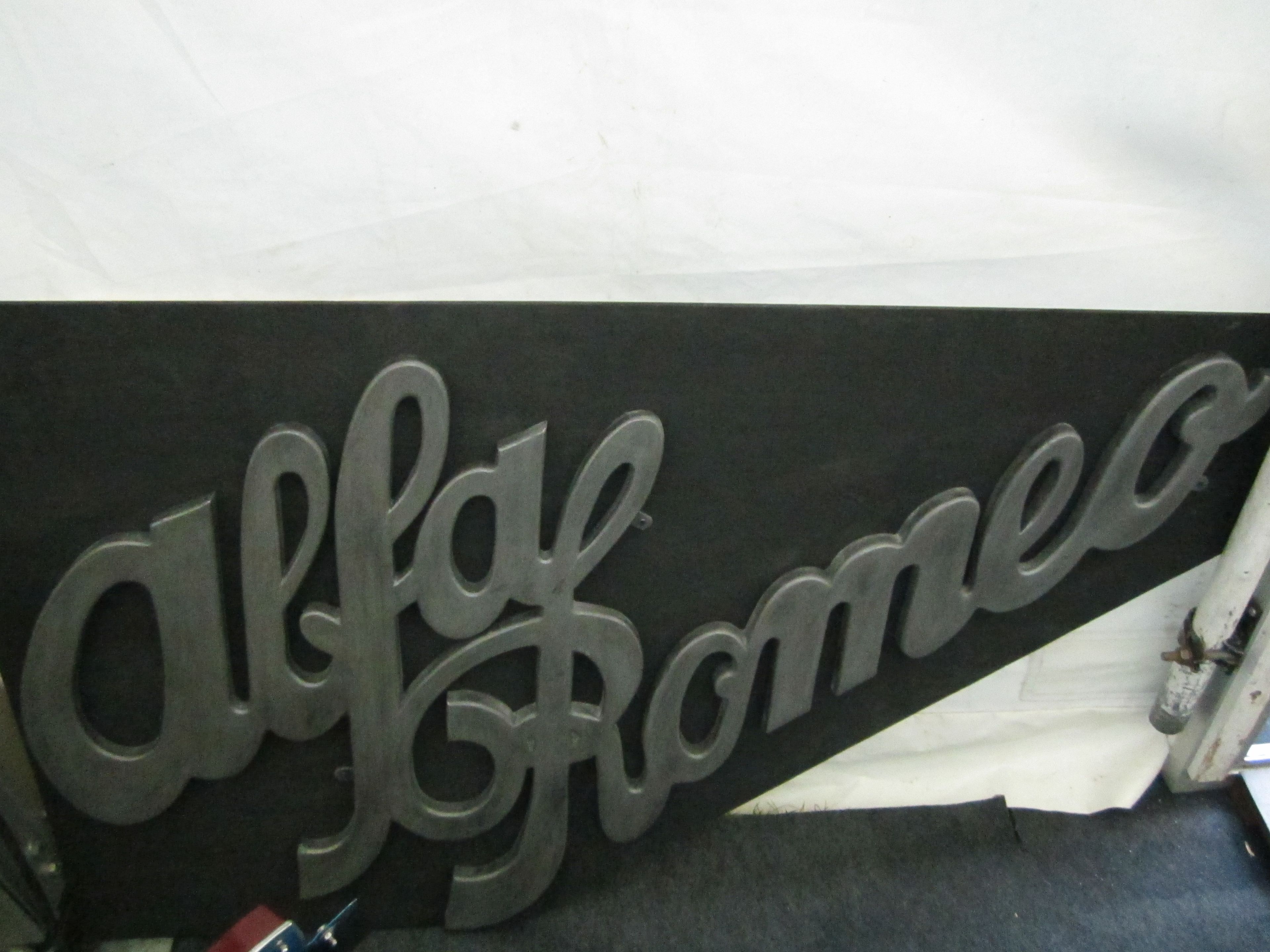 Bonhams Cars : An Alfa-Romeo garage display emblem,