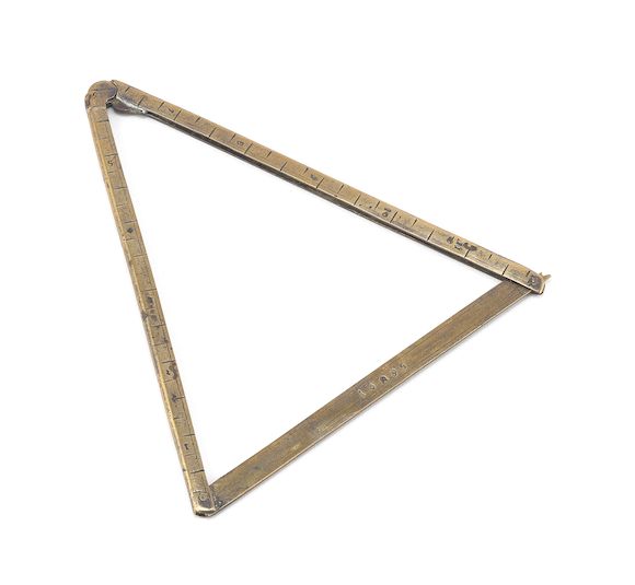 Bonhams : A double folding brass rule and set square, German, dated 1695,