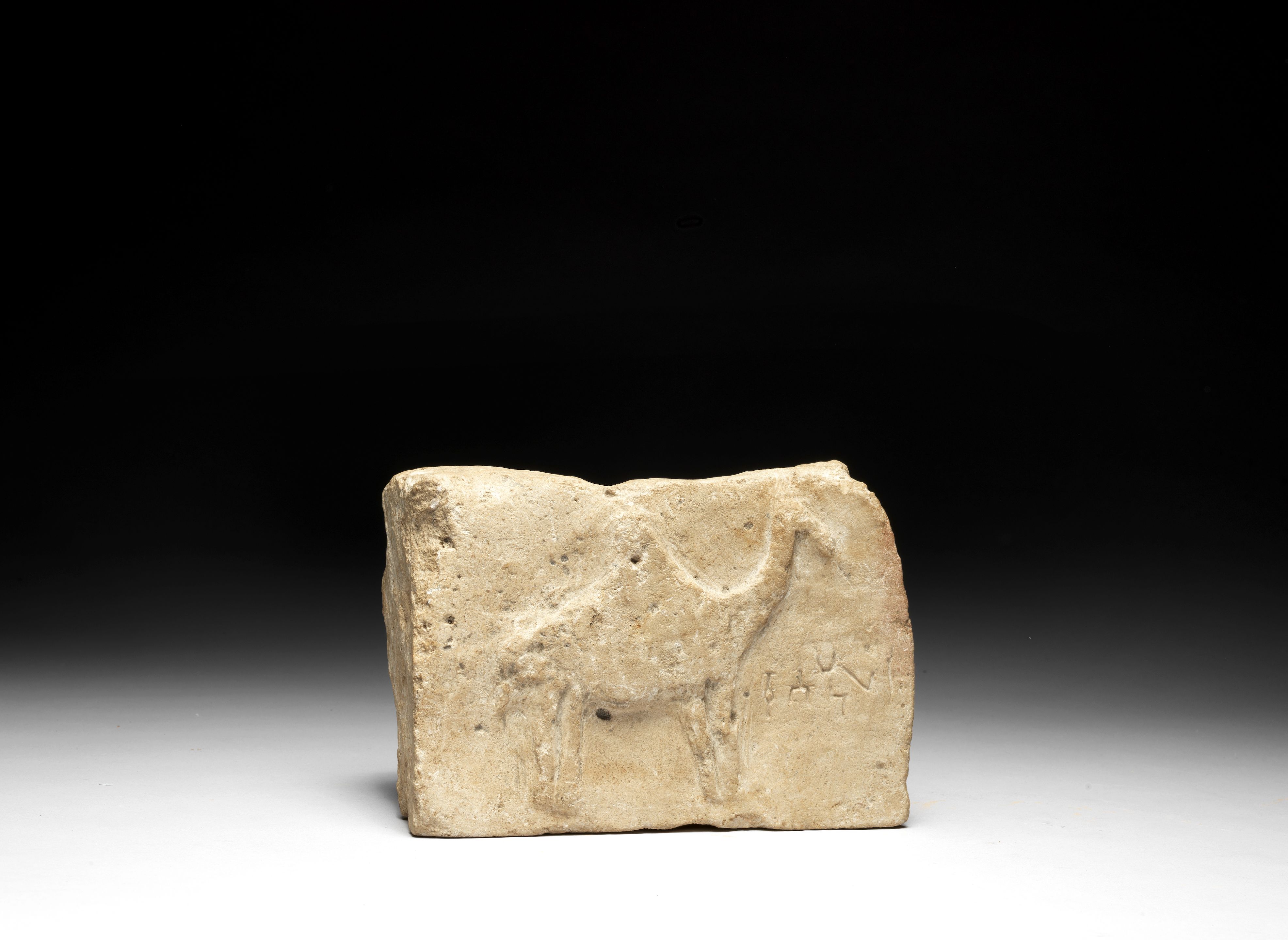 Bonhams : A South Arabian limestone relief fragment